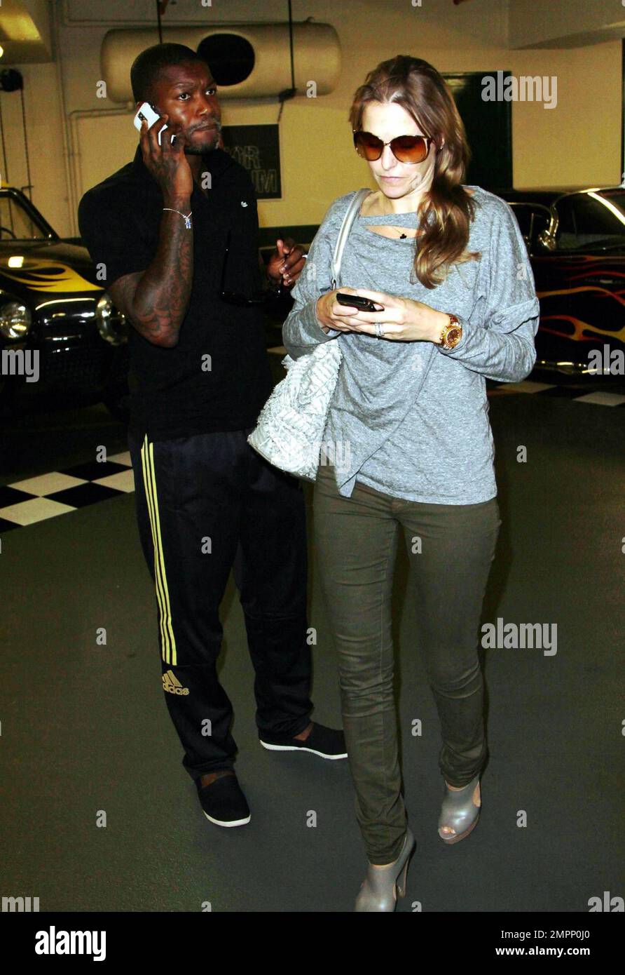 EXCLUSIVE!! French soccer player Djibril Cisse and wife Jude arrive at ...