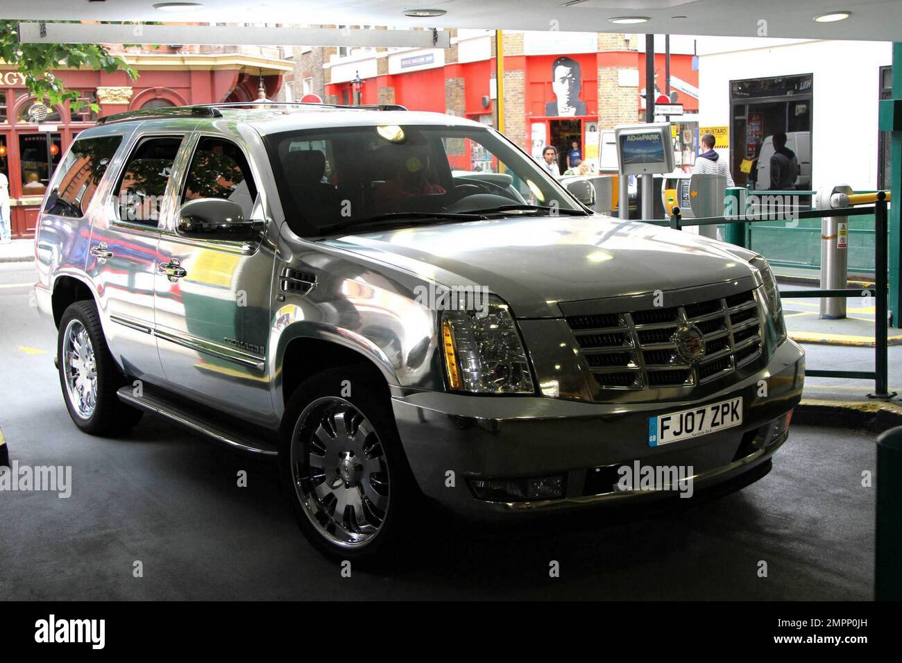 EXCLUSIVE!! French soccer player Djibril Cisse and wife Jude arrive at ...