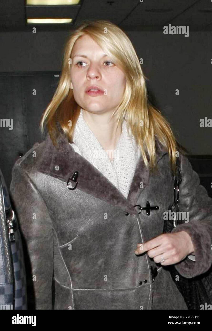 Dressed in a winter coat and boots actress Claire Danes arrives at LAX ...