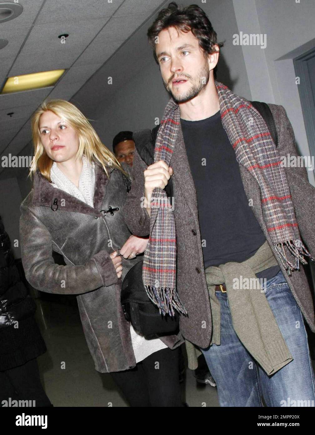 Dressed in a winter coat and boots actress Claire Danes arrives at LAX ...
