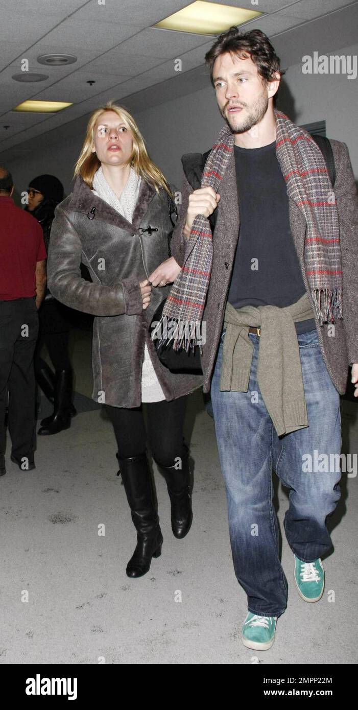 Dressed in a winter coat and boots actress Claire Danes arrives at LAX ...