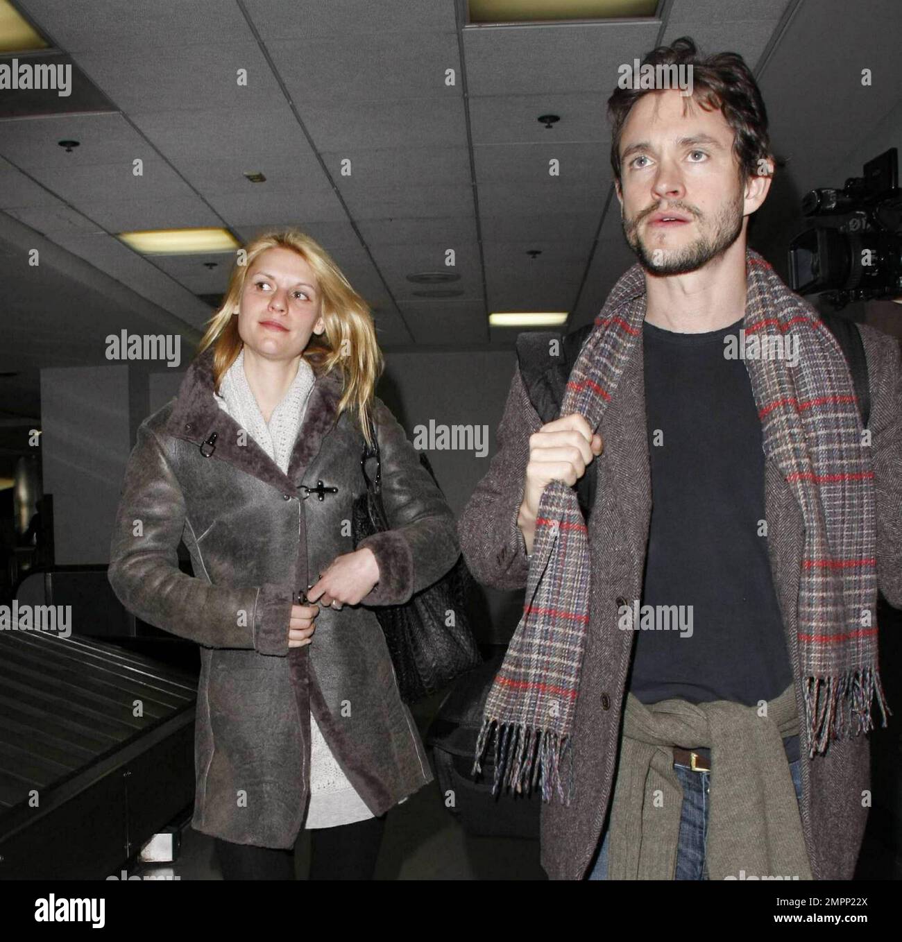 Dressed in a winter coat and boots actress Claire Danes arrives at LAX ...