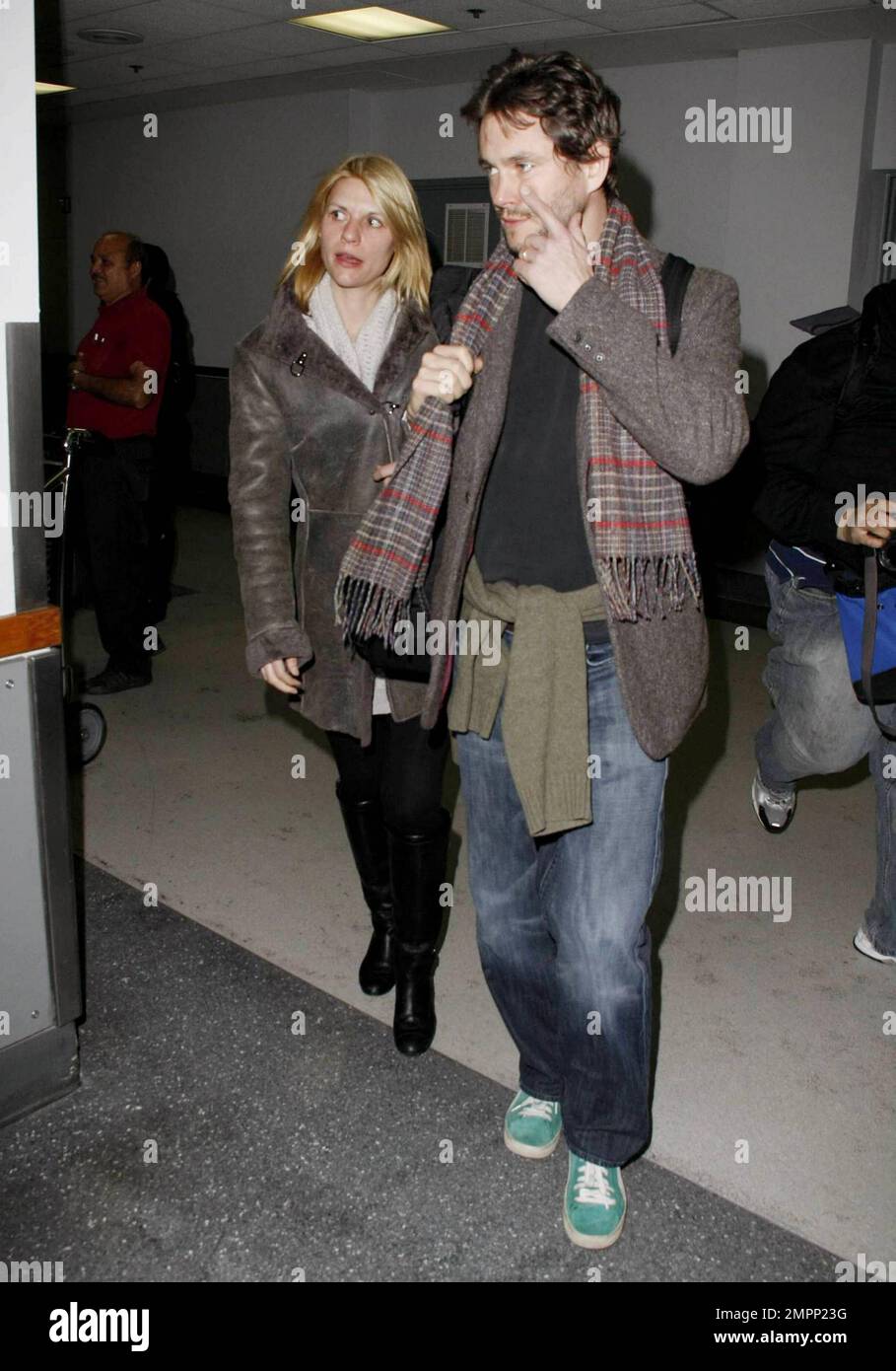 Dressed in a winter coat and boots actress Claire Danes arrives at LAX ...