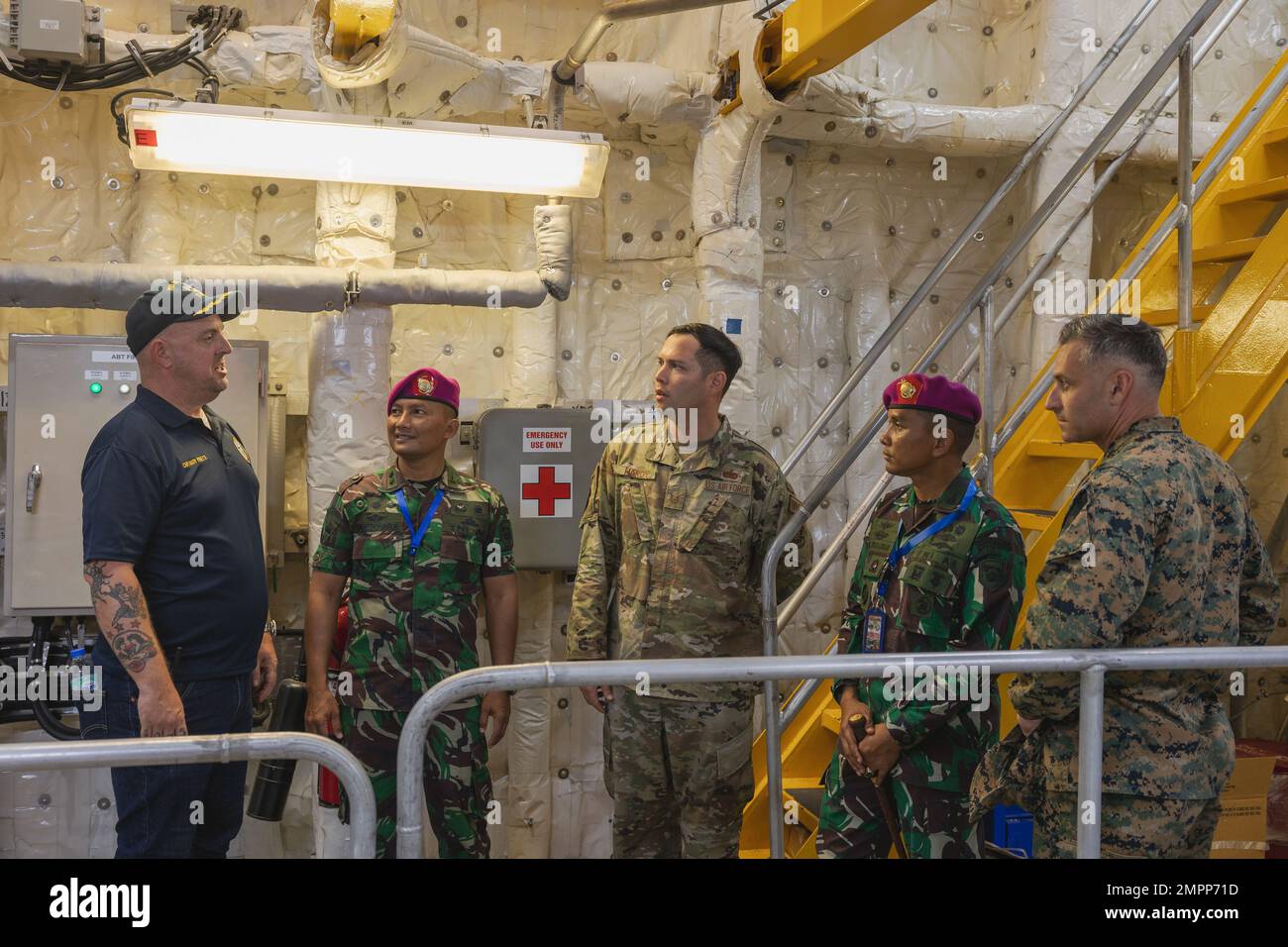 U.S. Navy Sailor Capt. Andy Peretti, far left, captain of the USNS ...