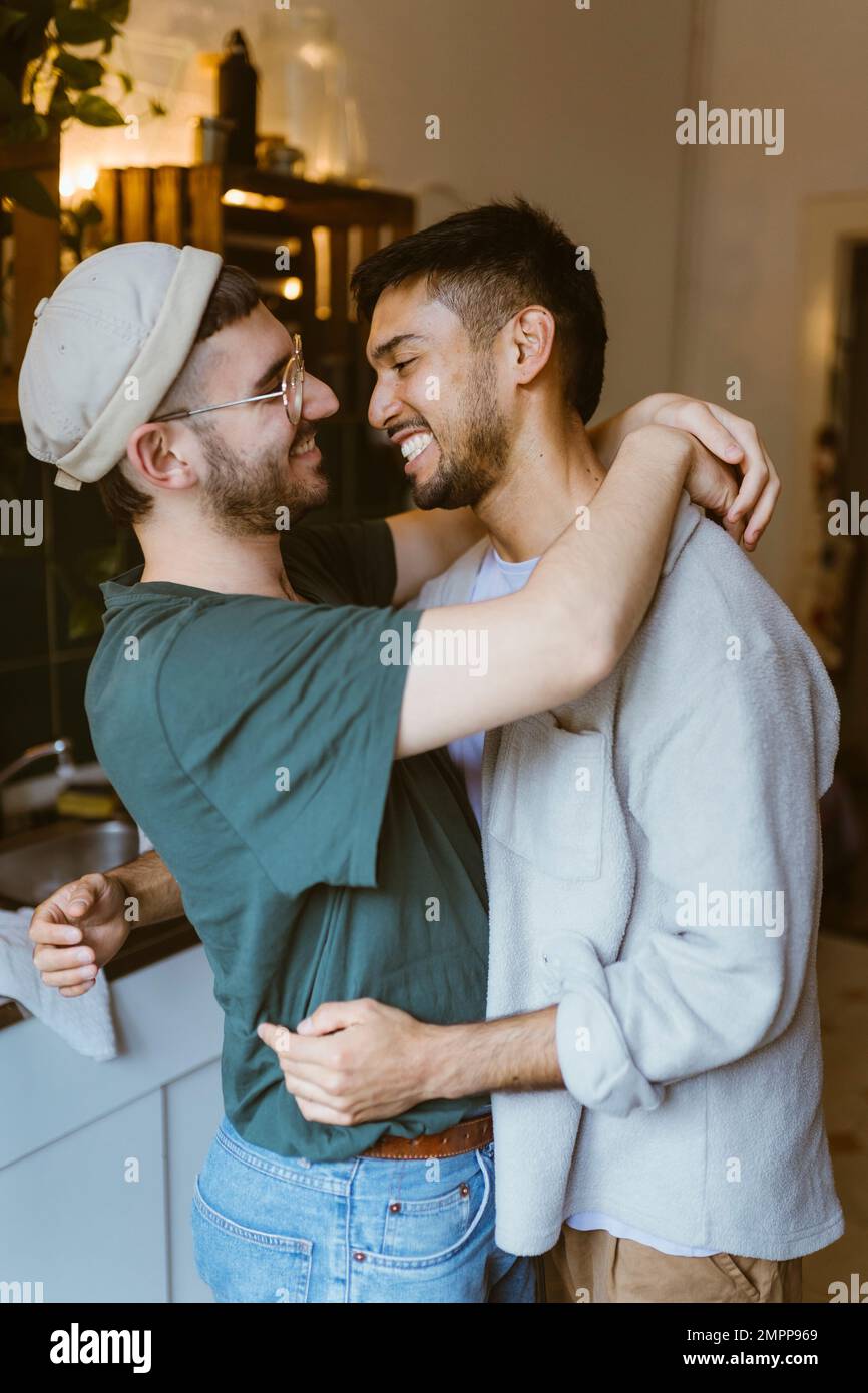 Happy gay couple looking other hi-res stock photography and images - Alamy