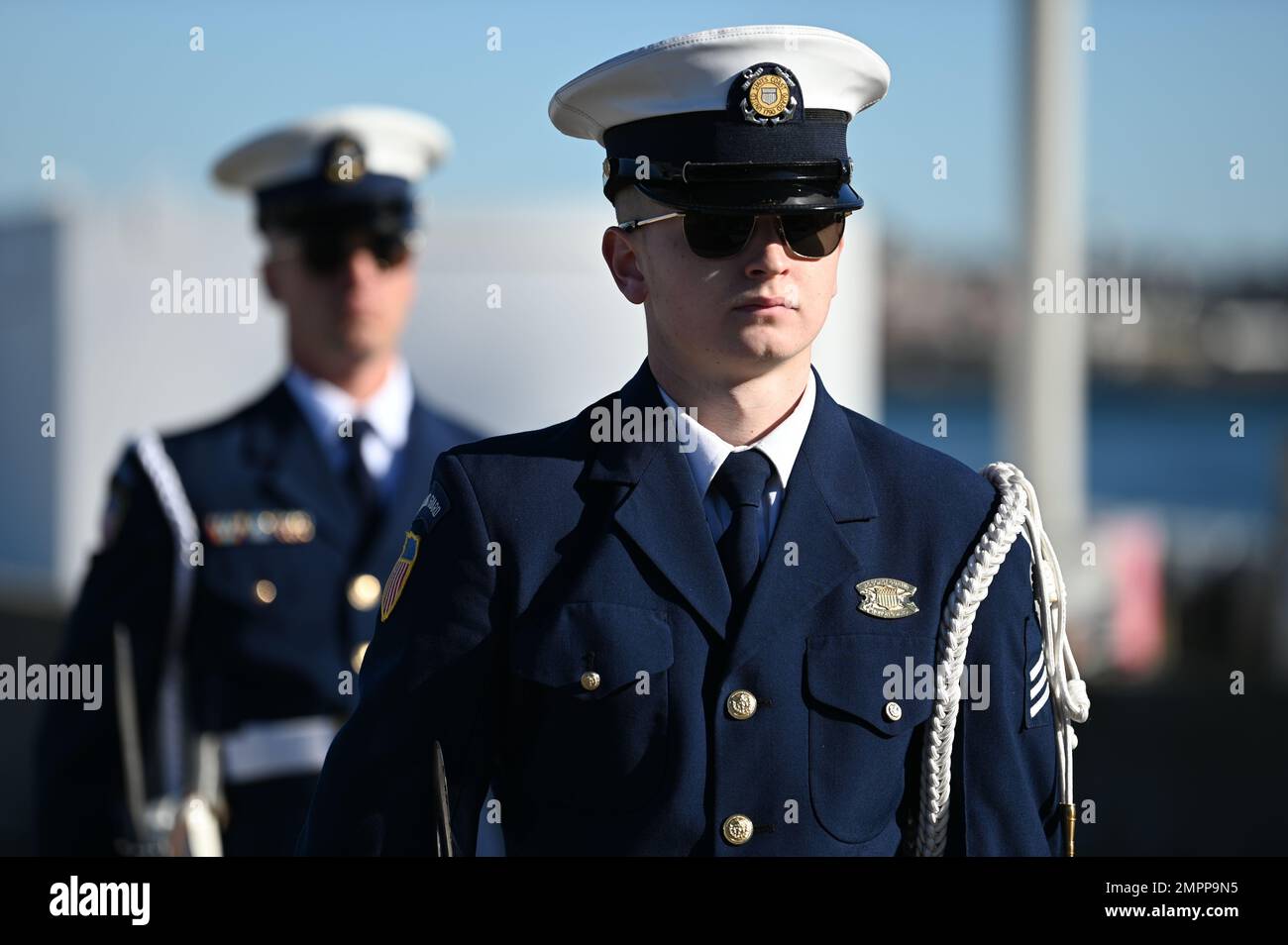A member of Coast Guard Ceremonial Honor Guard stands at attention ...