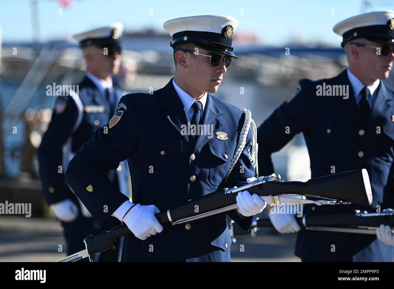 Members of the Coast Guard Ceremonial Honor Guard perform during the ...