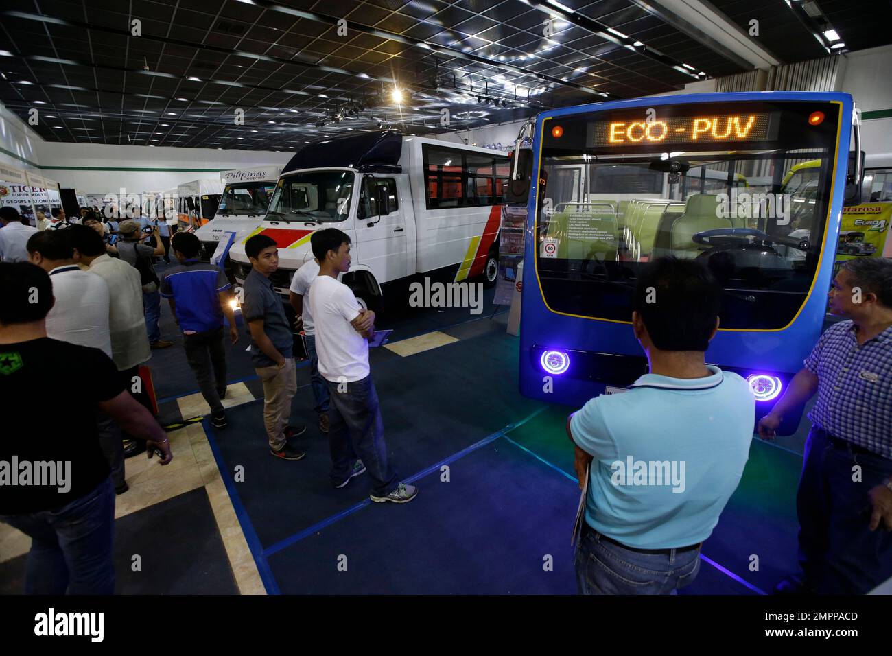 In this Oct. 12, 2017, photo, visitors look at electric and Euro 4 ...