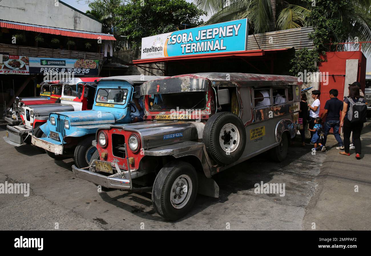 In this Sept. 26, 2017, photo, passengers board jeepneys at a terminal ...