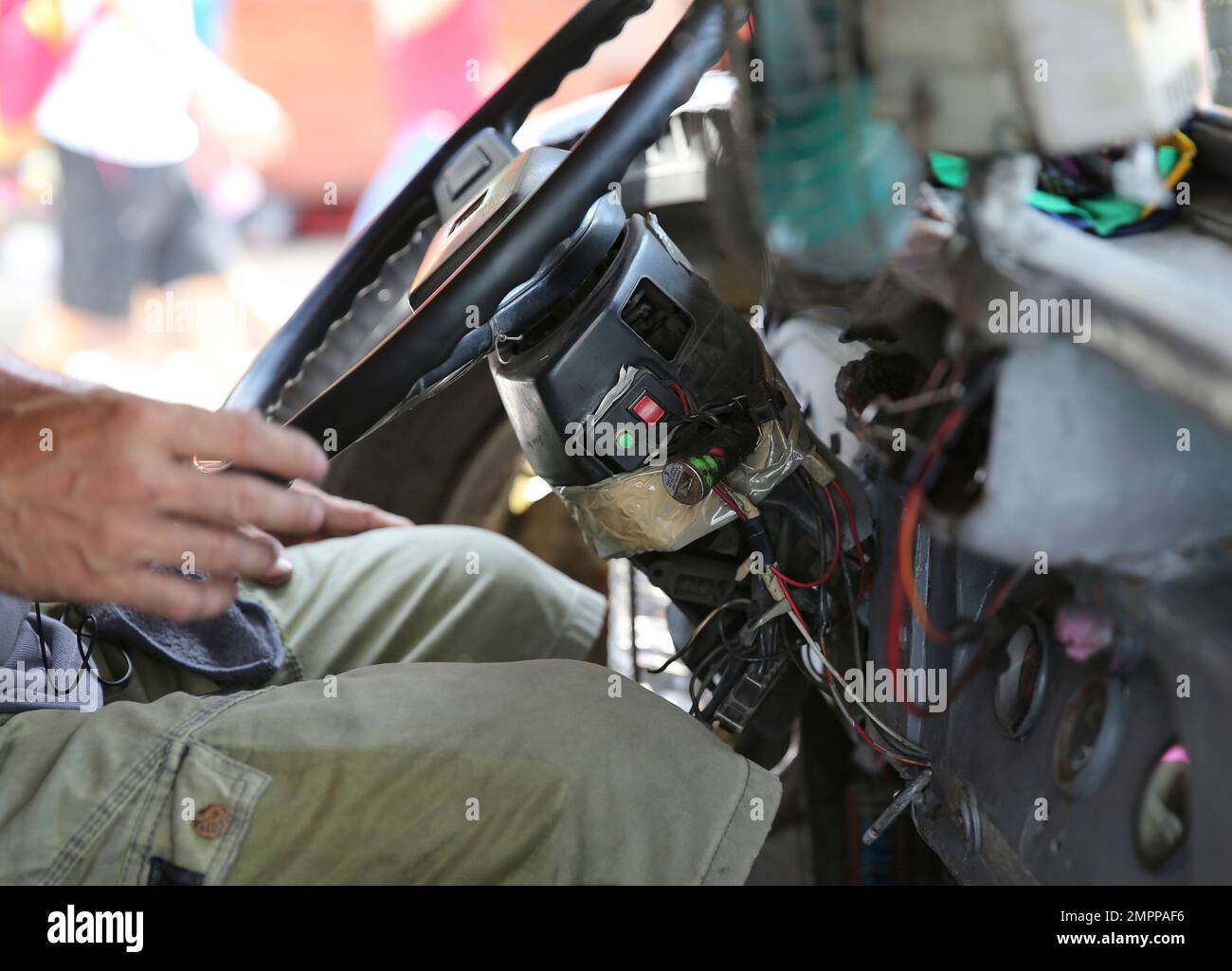 In this Sept. 19, 2017, photo, a Filipino driver sits at the wheel of ...