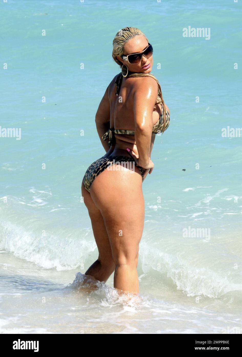 Coco shows off her enviable curves in an animal print bikini. The reality star took to the water ...