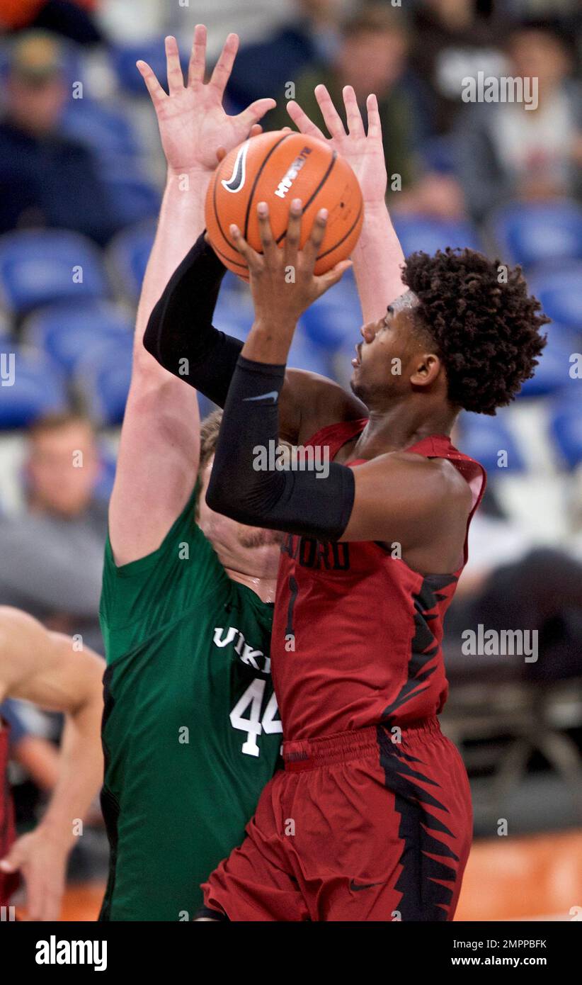 Stanford guard Daejon Davis, right, shoots over Portland State center ...