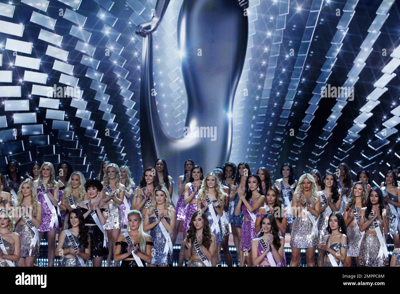 Contestants stand on stage at the Miss Universe pageant Sunday, Nov. 26 ...
