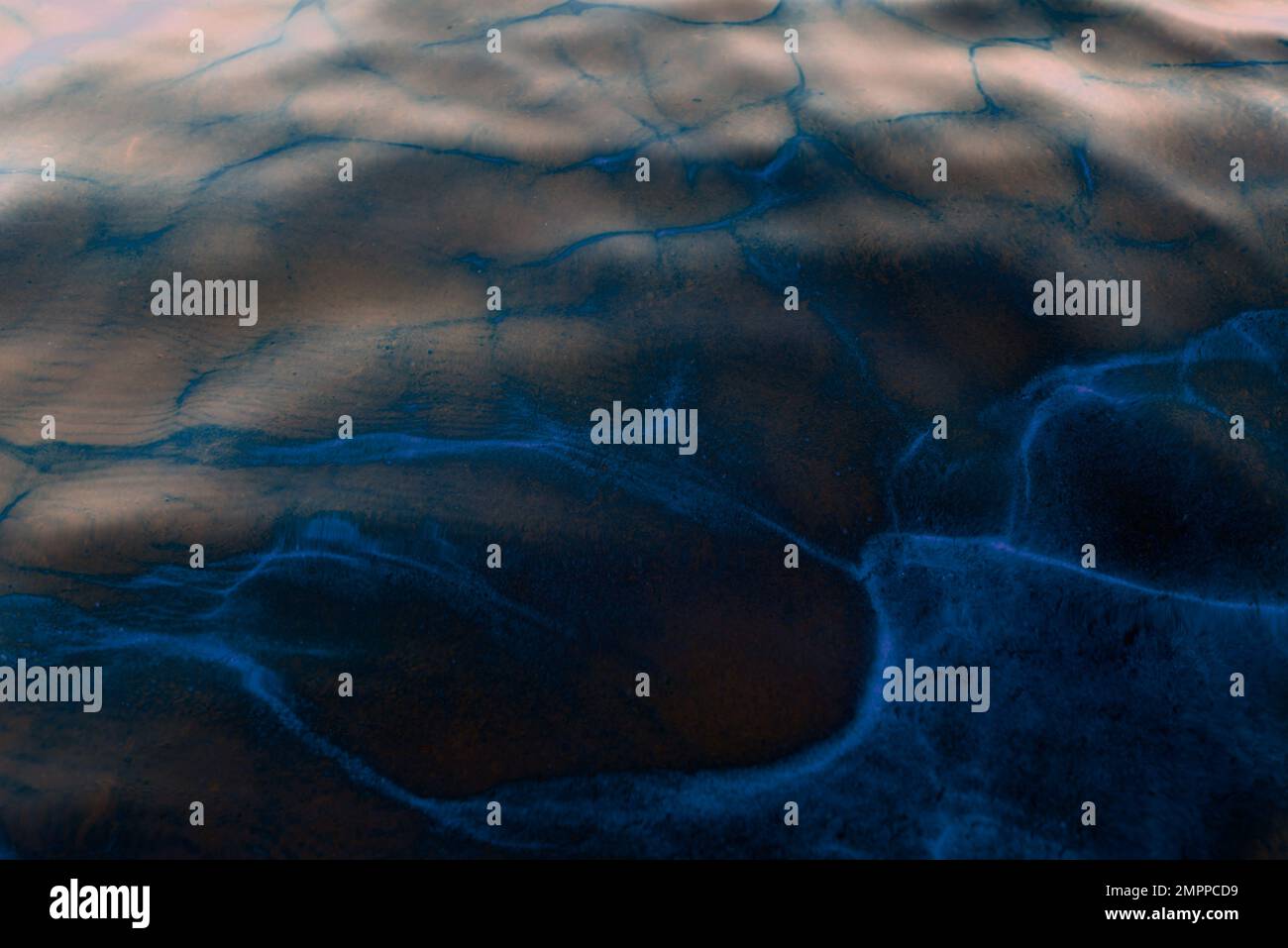 The background is natural. Abstract photo of a glowing water surface ...