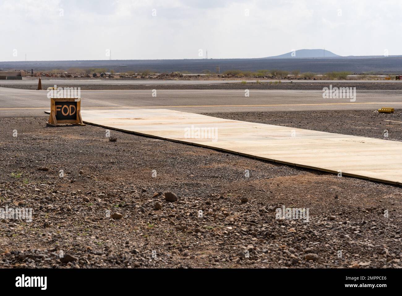 A sign designating a location as a foreign object damage checkpoint is ...