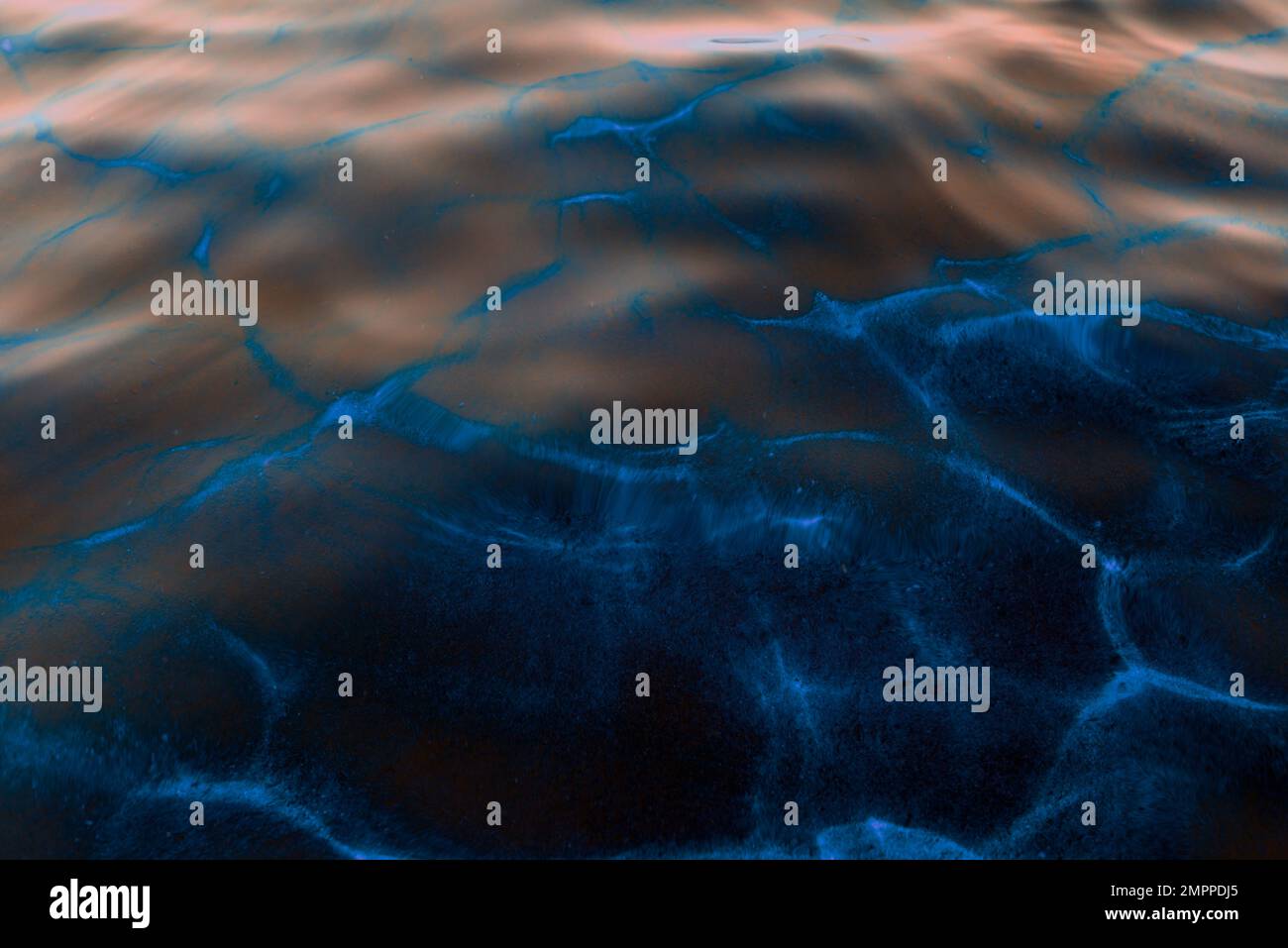 The background is natural. Abstract photo of a glowing water surface ...