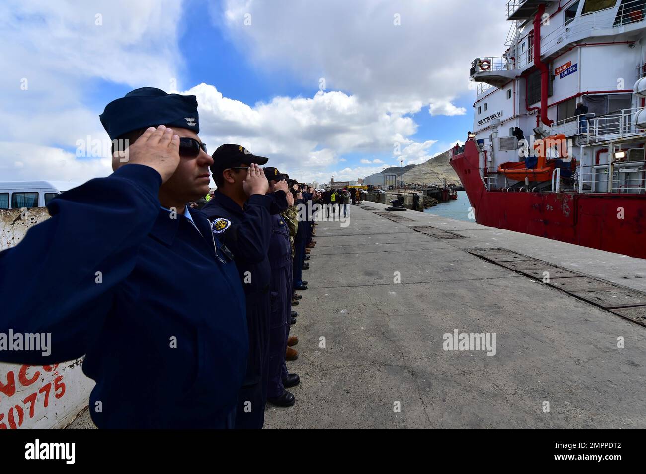 Argentine and US Navy sailors salute as the ship Sophie Siem departs ...
