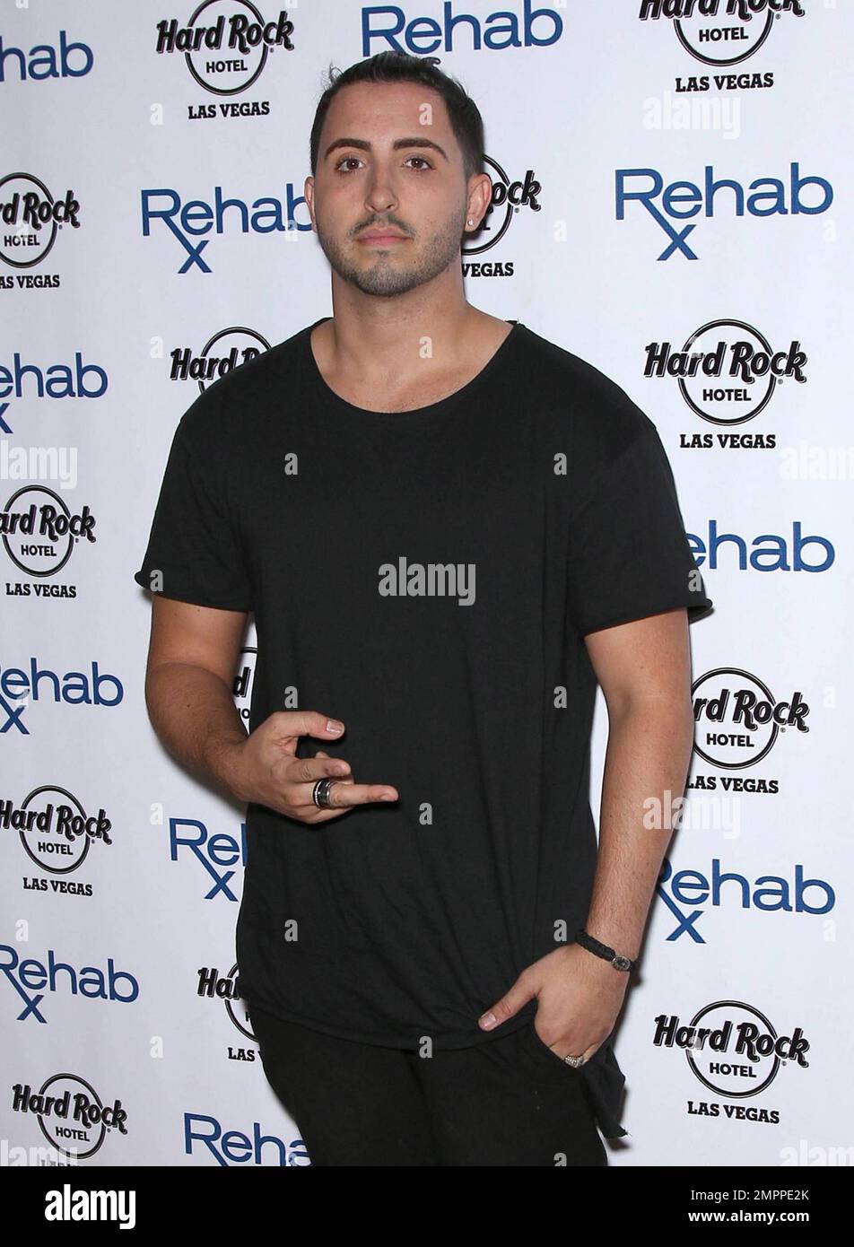 Colby O'Donis flips the bird as he walks the carpet at REHAB inside the ...