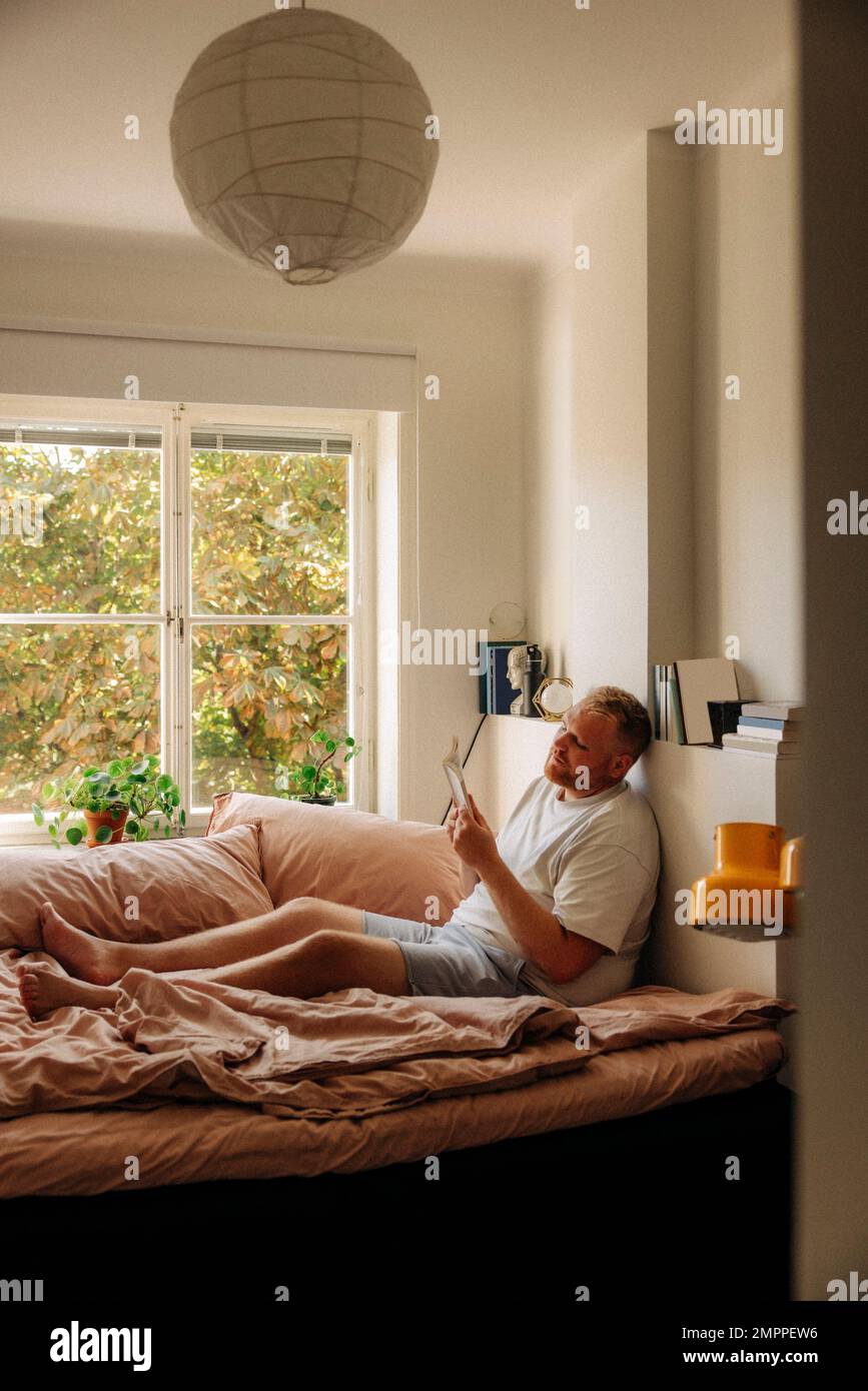 Overweight man bed hi-res stock photography and images - Alamy