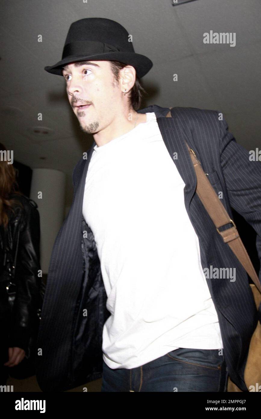 Colin Farrell signs autographs as he makes his way through the terminal ...