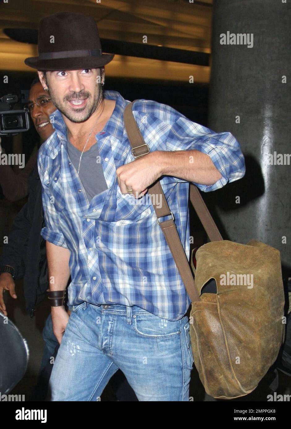 Colin Farrell arrives all smiles at LAX after a short four day break in ...