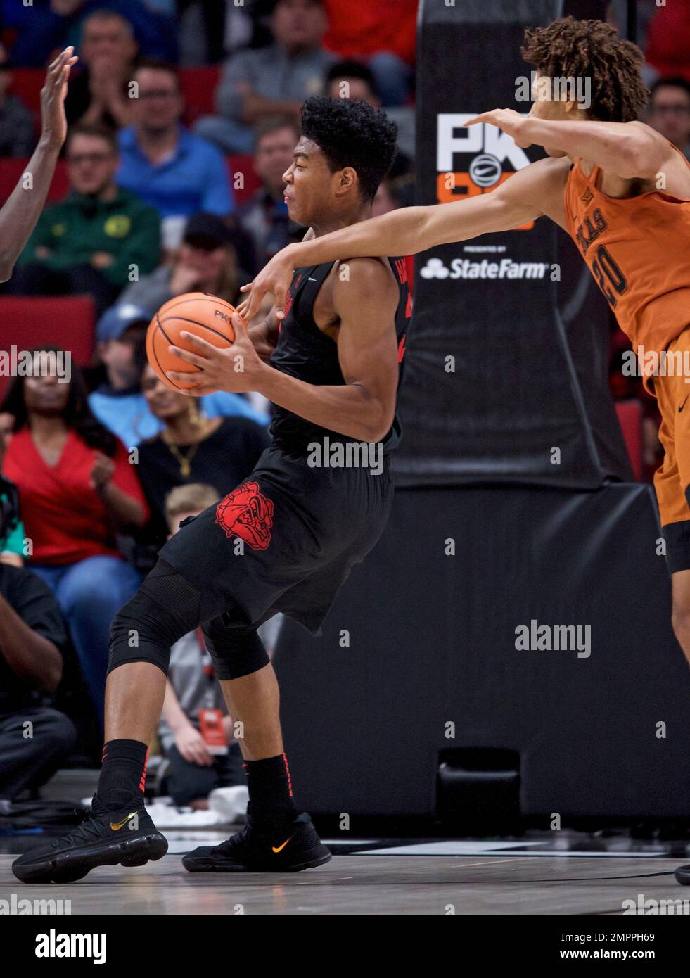 Gonzaga forward Rui Hachimura, left, is fouled by Texas forward Jericho ...