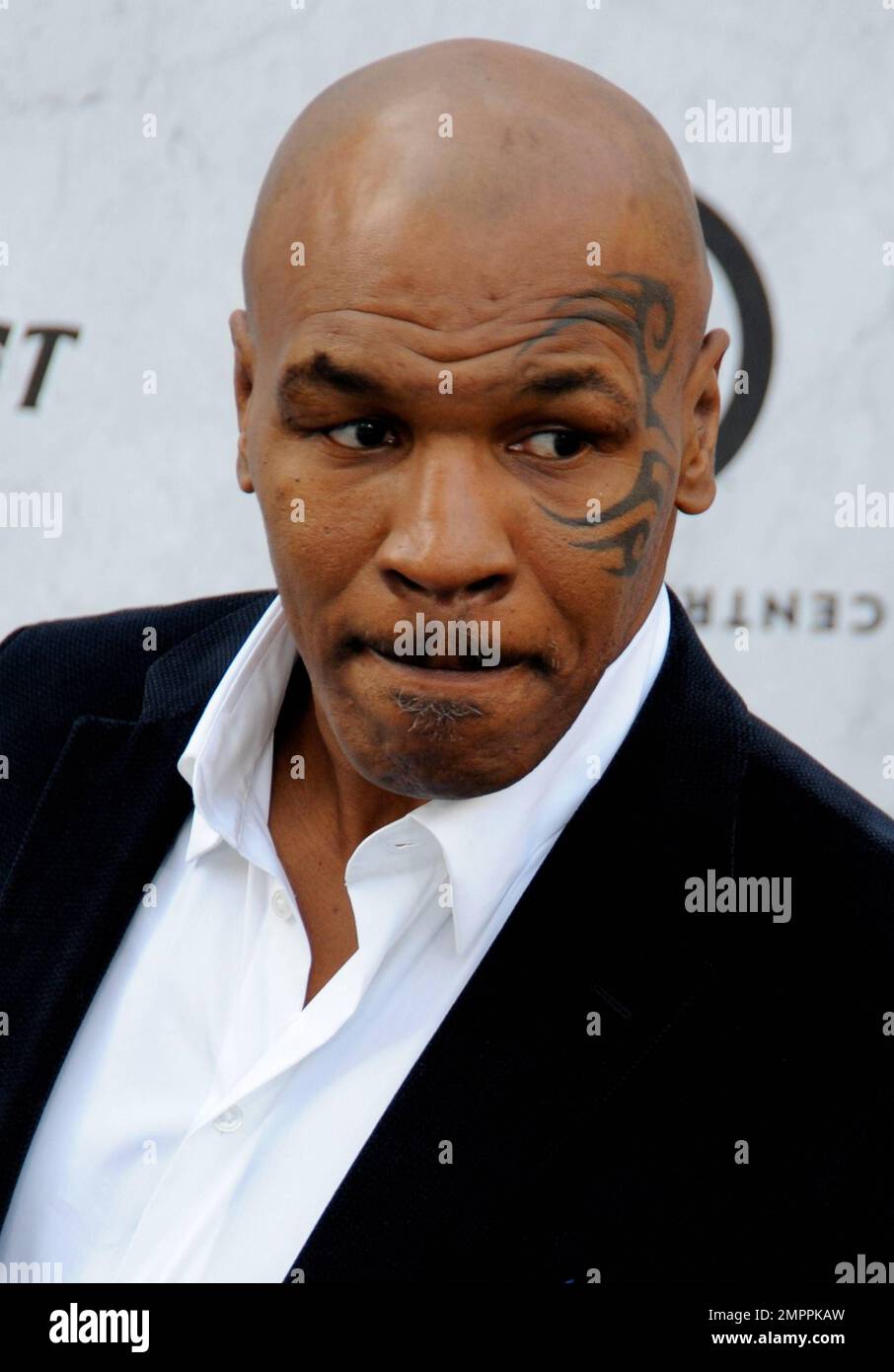 Mike Tyson arrives at "COMEDY CENTRAL Roast of Charlie Sheen" held at ...