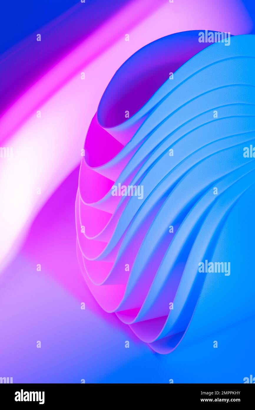 Neon abstract curvy shape against the colorful pink background ...