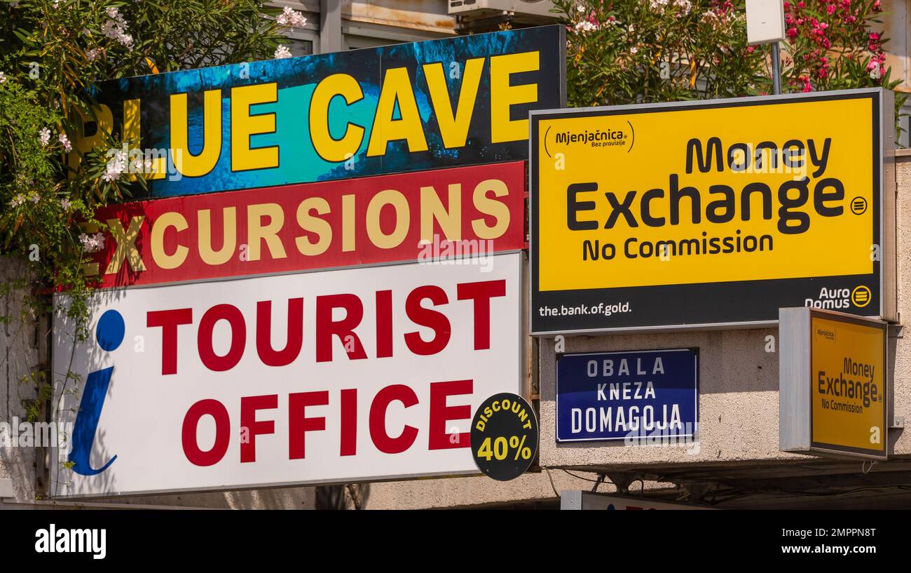 SPLIT, CROATIA, EUROPE - Tourism signs for Blue Cave and Money Exchange ...