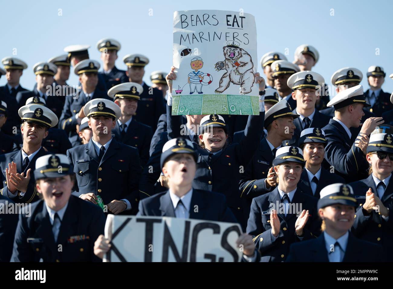 Coast Guard Academy cadets get hyped up from the stands as they await ...