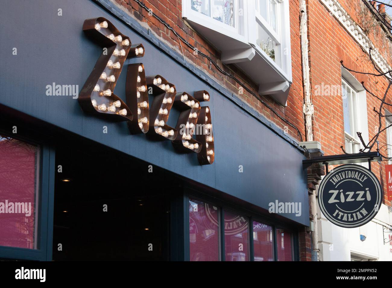 The Zizzi Italian Restaurant sign in Wokingham in the UK Stock Photo ...
