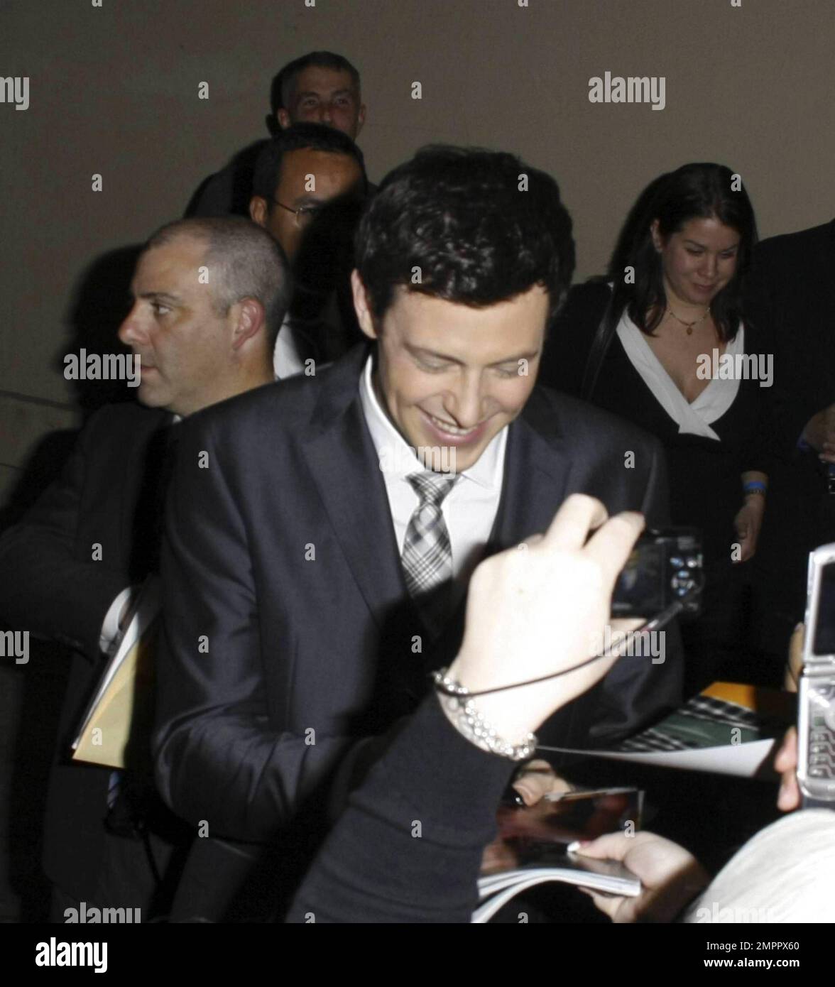 "Glee" star Cory Monteith looks handsome in a suit and tie as he signs ...