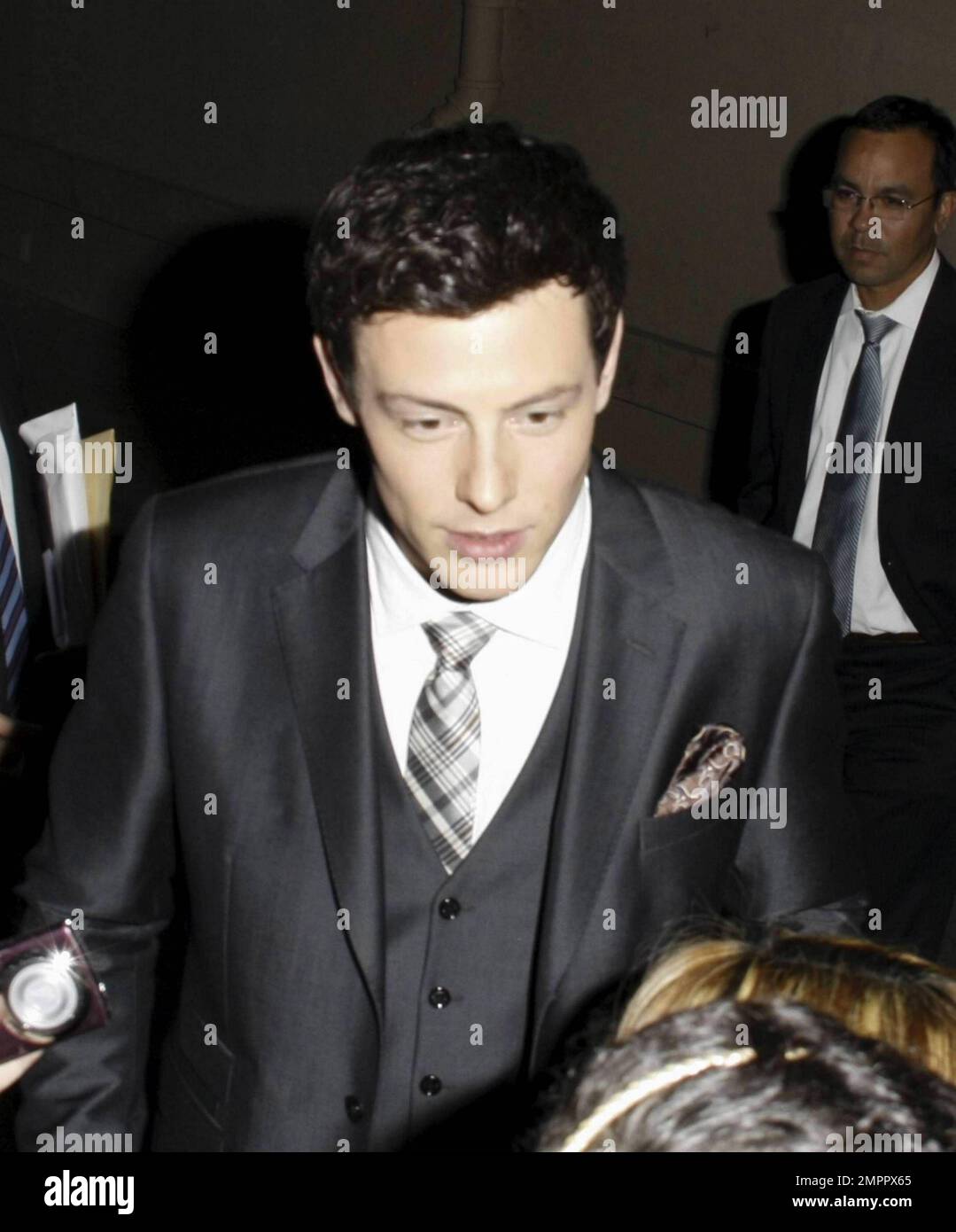 "Glee" star Cory Monteith looks handsome in a suit and tie as he signs ...