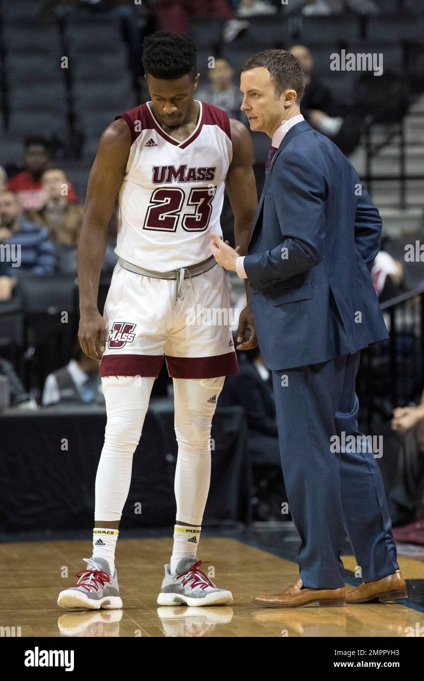 UMass head coach Matt McCall talks to guard C.J. Anderson (23) during ...