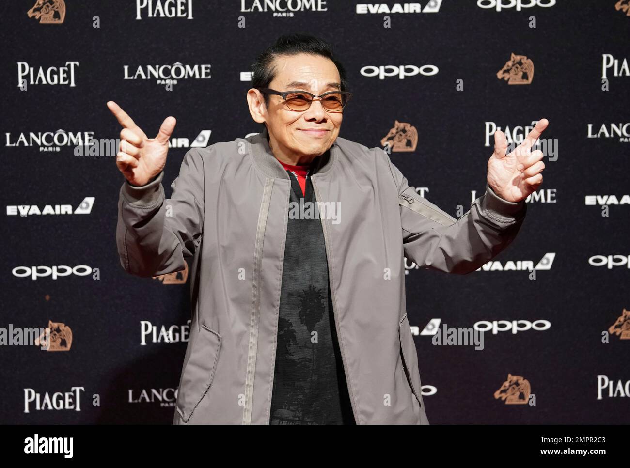 Hong Kong actor Teddy Robin poses on the red carpet at the 54th Golden ...