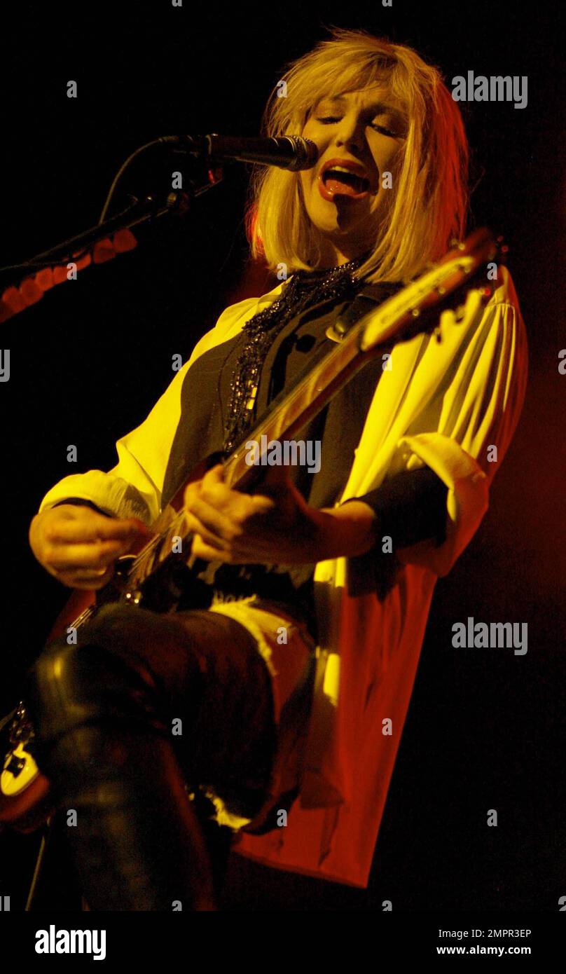 Courtney Love smokes a cigarette on stage as she performs live in ...