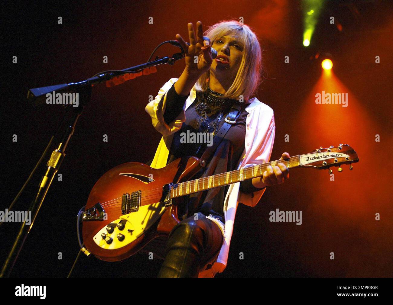 Courtney Love smokes a cigarette on stage as she performs live in ...