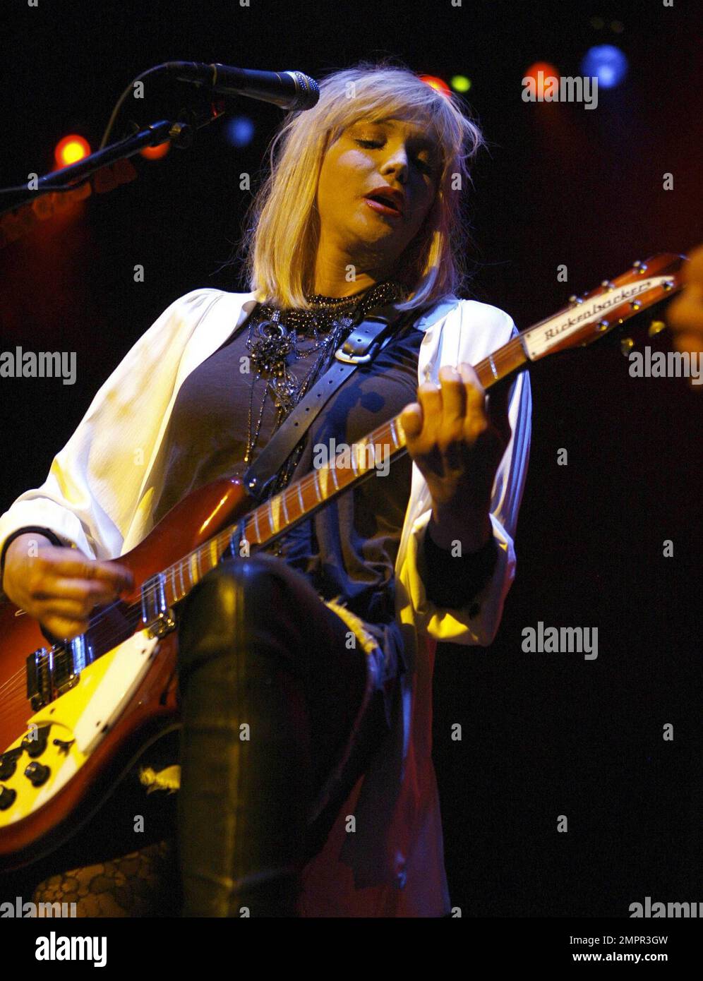 Courtney Love smokes a cigarette on stage as she performs live in ...