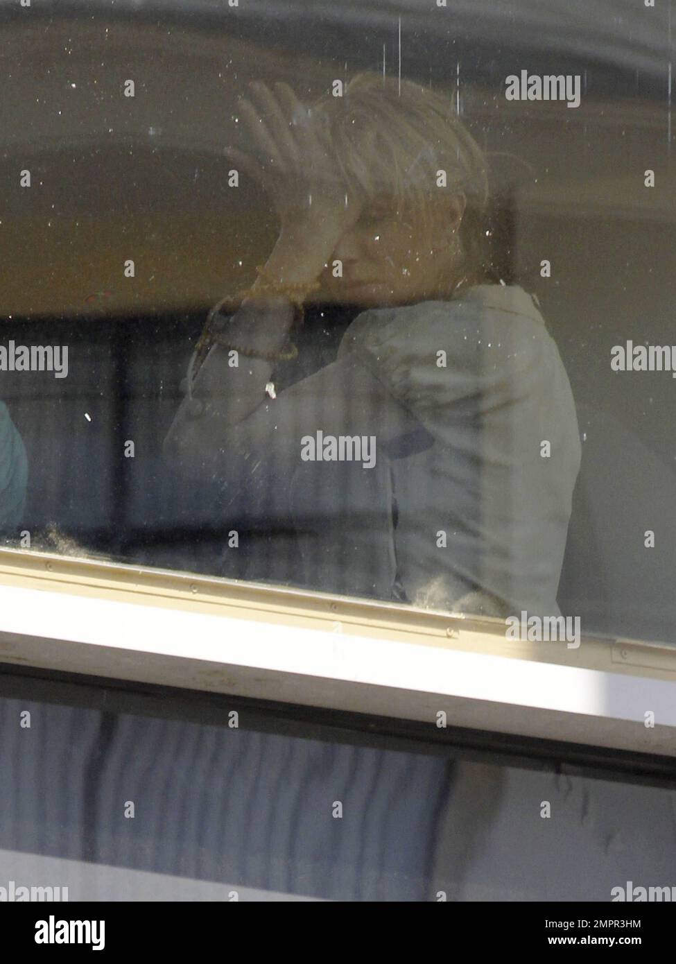 Courtney Love covers her face with her hands during what looks to be a ...
