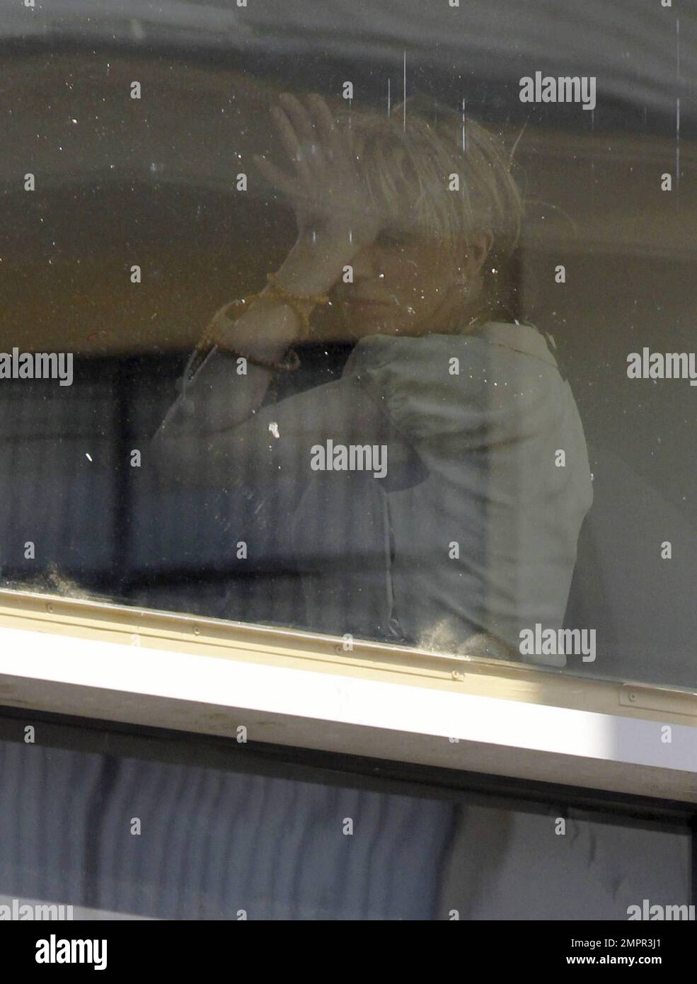 Courtney Love covers her face with her hands during what looks to be a ...