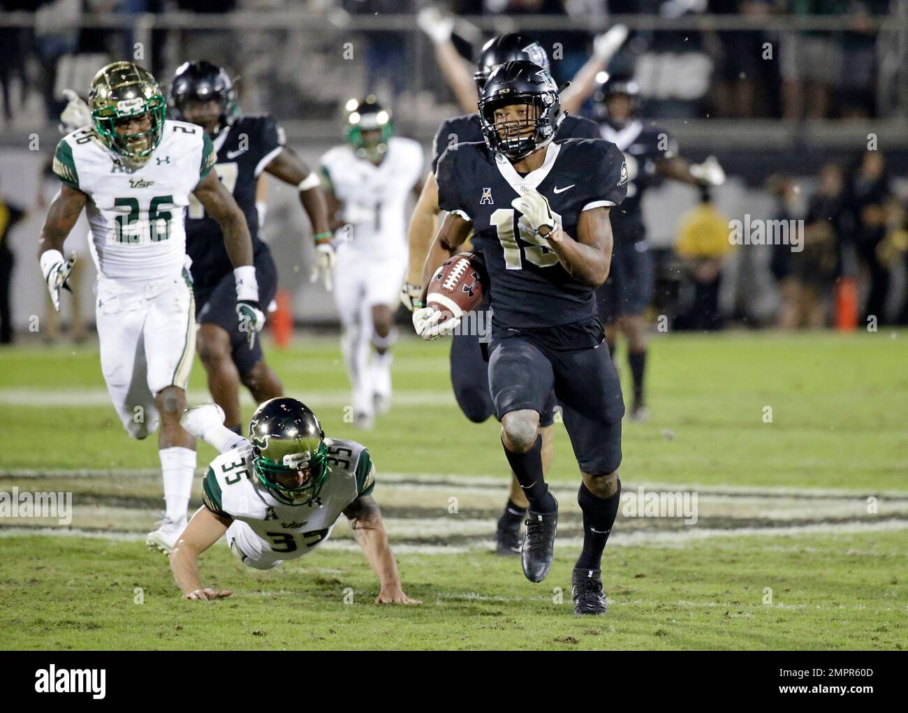 Central Florida's Mike Hughes runs a 95-yard touchdown kick off return ...