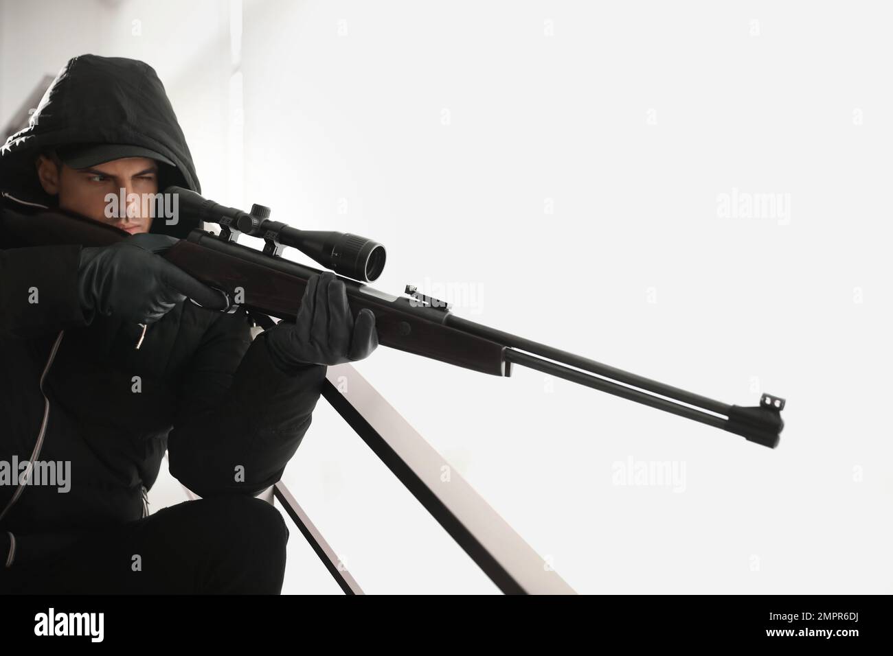 Man rifle barrel indoors hi-res stock photography and images - Alamy