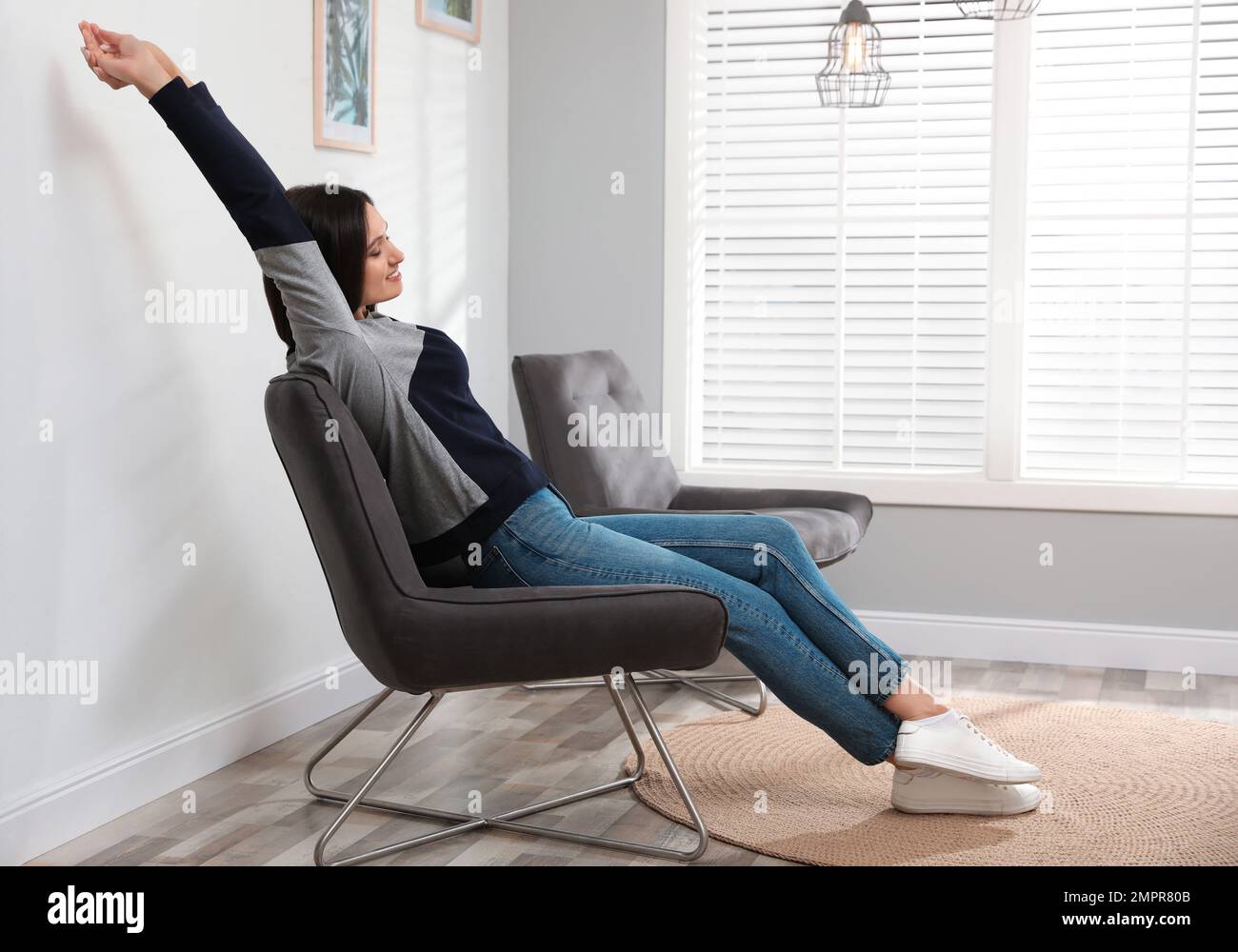 Young woman relaxing at home. Peaceful rest Stock Photo - Alamy