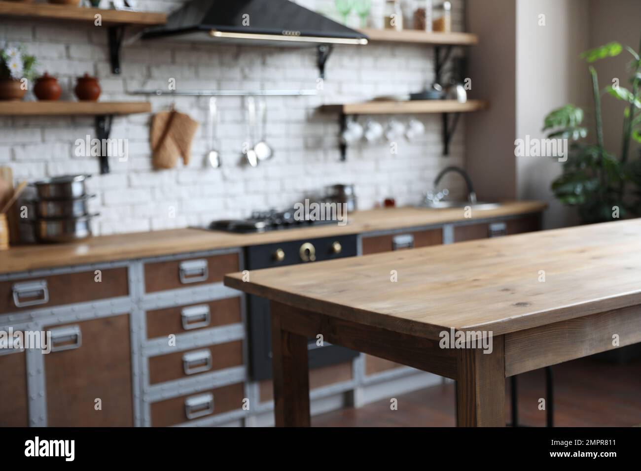 Empty wooden table in beautiful kitchen. Interior design Stock Photo ...