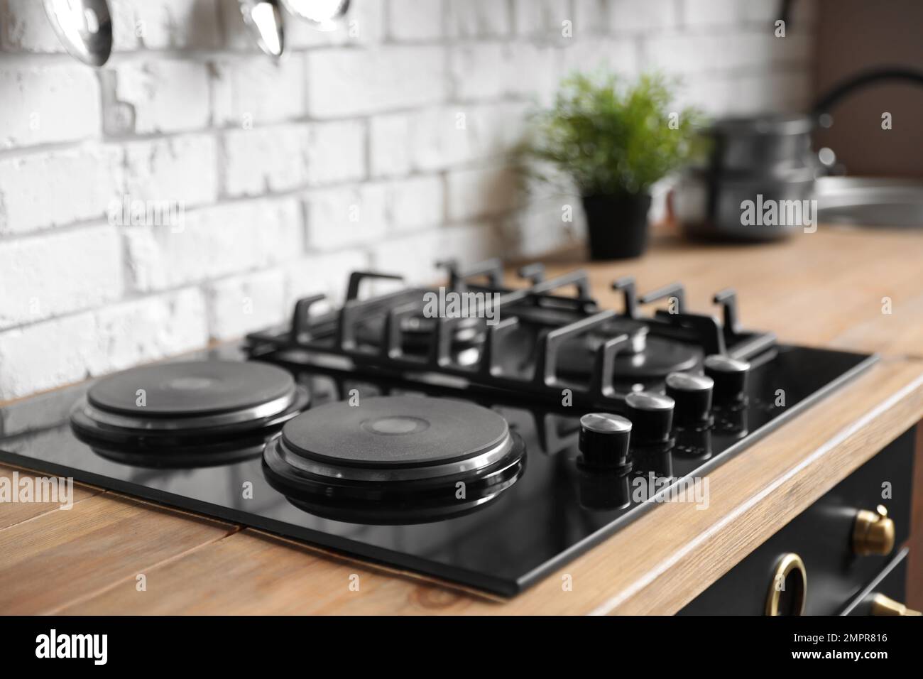 New modern stove with gas and electric burners in kitchen Stock Photo ...