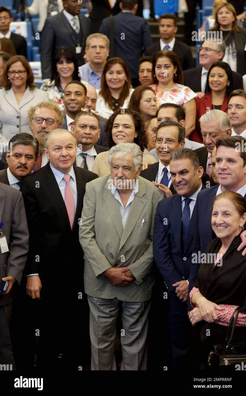 Uruguay's former President Jose Mujica, center, flanked by Parlatino ...