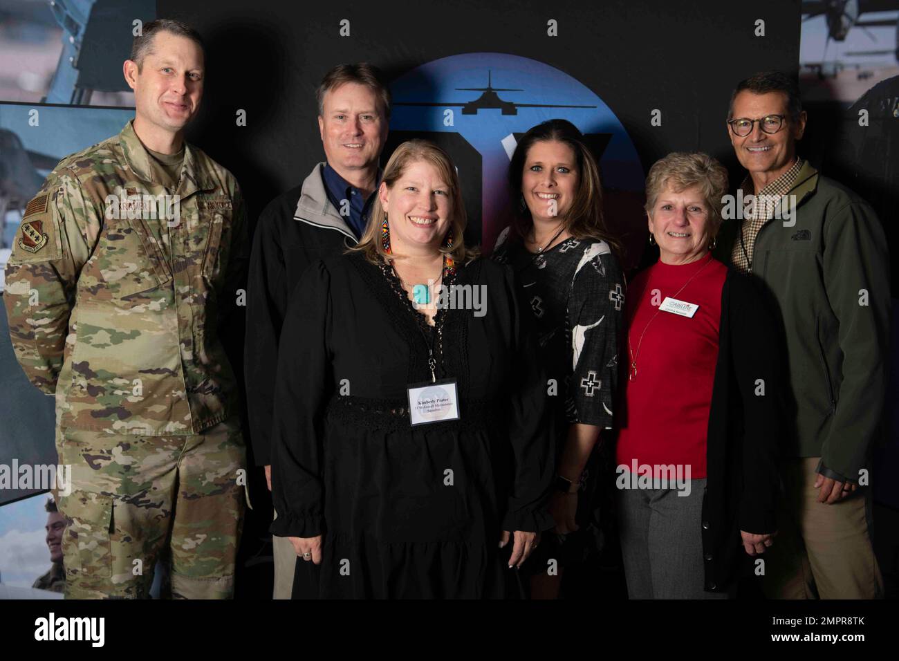 Col. Joseph Kramer, 7th Bomb Wing commander, takes a group photo with ...