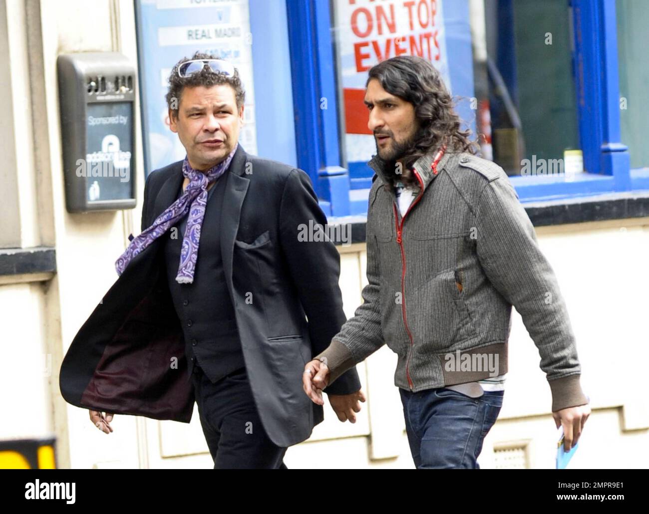"Coronation Street" star Craig Charles strolls with friends in London ...