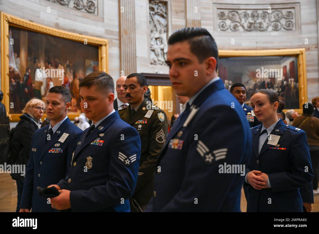 Service members from Joint Base Anacostia-Bolling examine artwork in ...