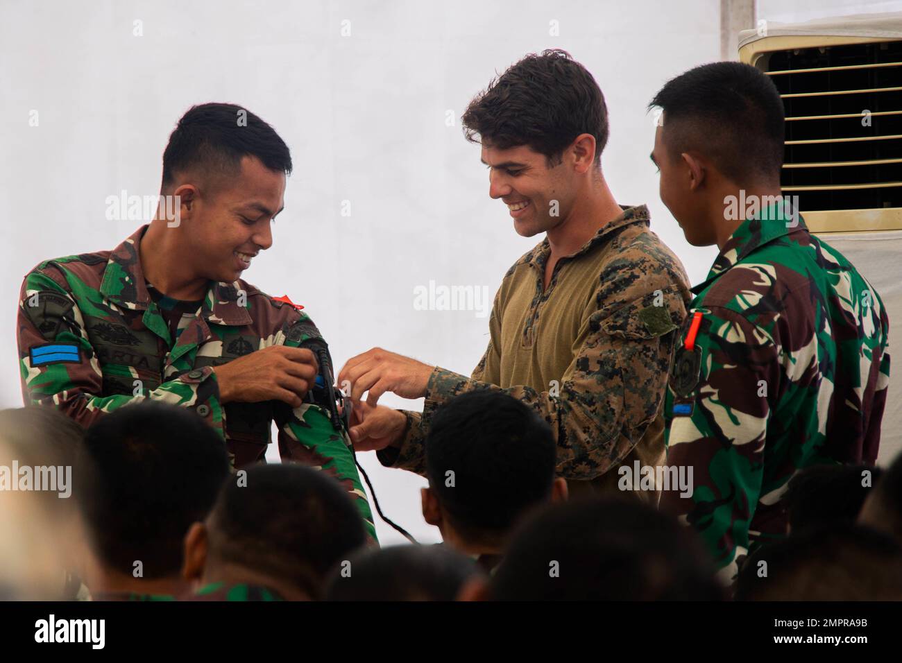 U.S. Marine Corps Sgt. Mark Broyles, center, a team leader with 1st ...
